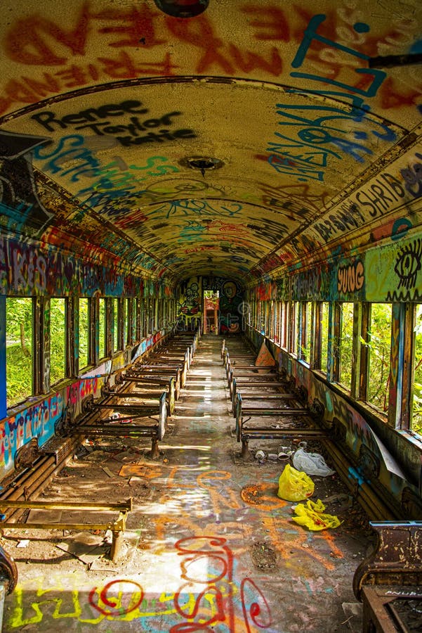 An Abandoned Train with Graffiti Stock Photo - Image of filled, bench ...