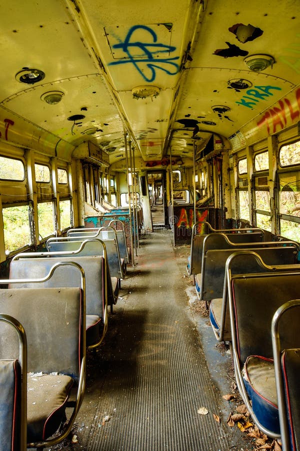 Abandoned Trolley Cars In Fall With Ominous Sky In Field With Rails ...