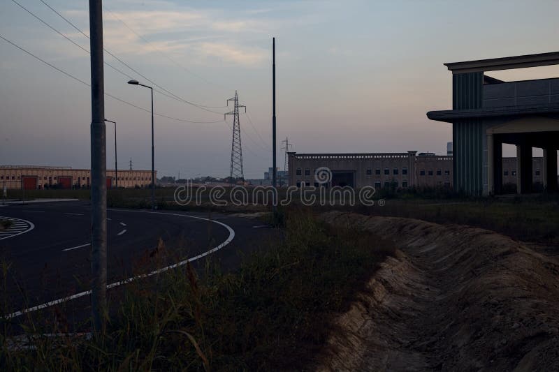 Abandoned Warehouses and Pylons Next To a Roundabout in an Industrial ...