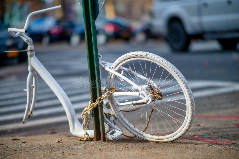 Abandoned White Bike in New York City. Bicycle without a Wheel L Stock ... Abandoned White Bike in New York City. Bicycle without a Wheel L Stock ...