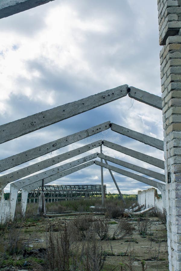 An Abandoned White Brick Building with a Triangular Roof Stock Image ...