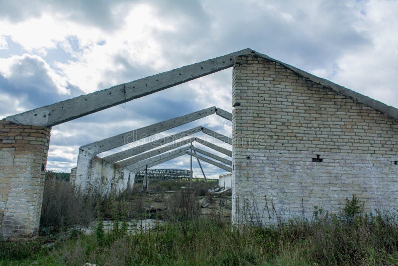 An Abandoned White Brick Building with a Triangular Roof Stock Image ...