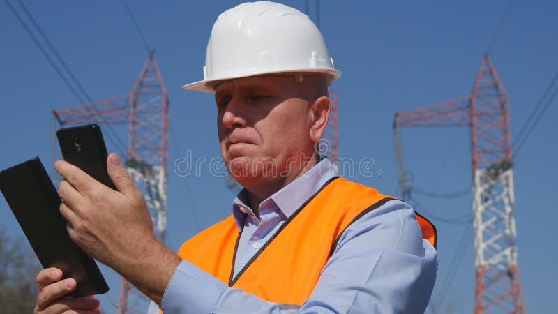 Engineer Working in Maintenance Using Cell Phone Communication. Stock ...