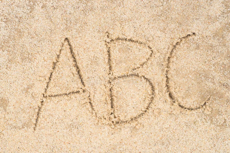 Alphabet Letters Handwritten In Sand On Beach Stock Photo - Image of ...