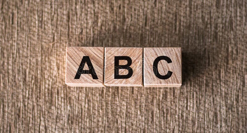 ABC Text on a Brown Background on Wooden Cubes Stock Image - Image of ...