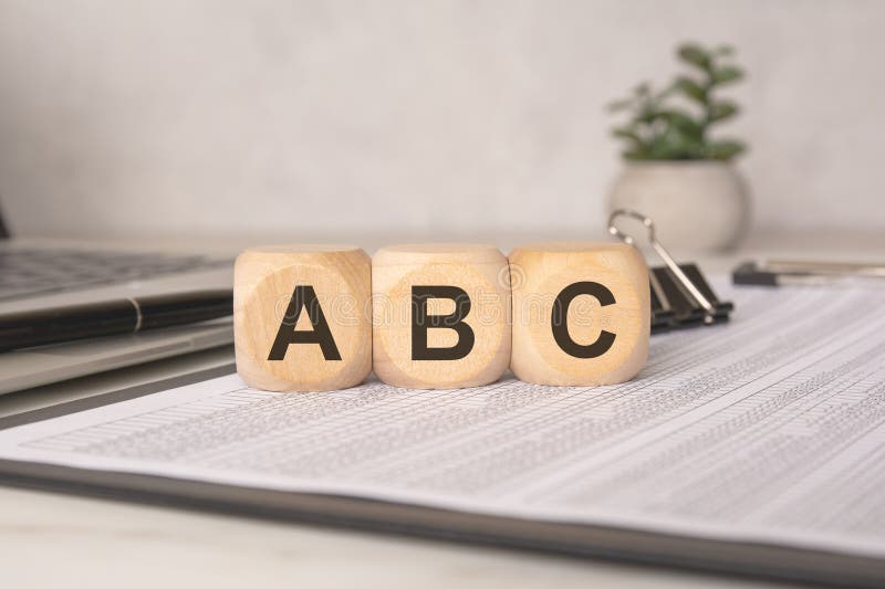 ABC Wooden Blocks on Documents with Business Office Background Stock ...