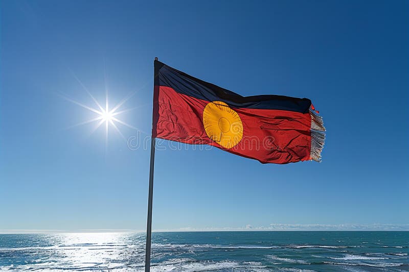 The Aboriginal Flag Flying in Front of the Ocean on a Clear Blue Sky, Bright and Sunny Day Stock ...
