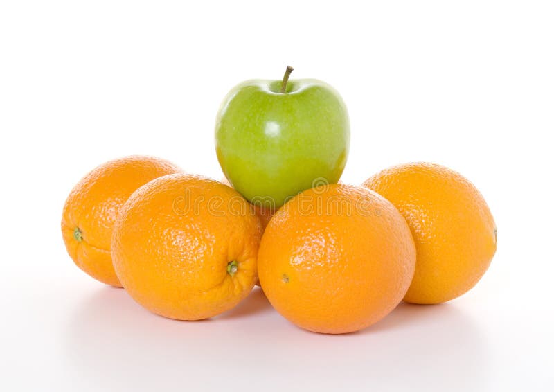 Above the Crowd - Green Apple To Oranges Stock Photo - Image of ...