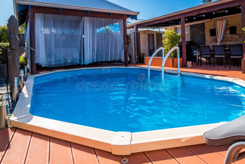 Above Ground Pool Sunken Below Ground and Surrounded by Decking ...