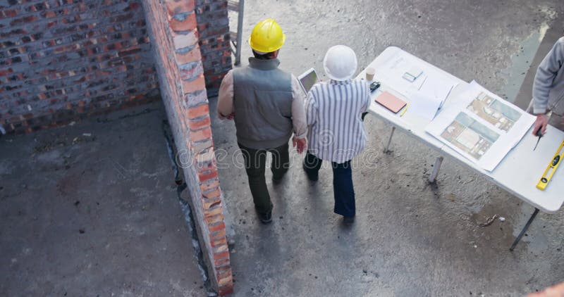 Above, Handshake and People on Construction Site for Plan, Collaboration or Technology at Table ...