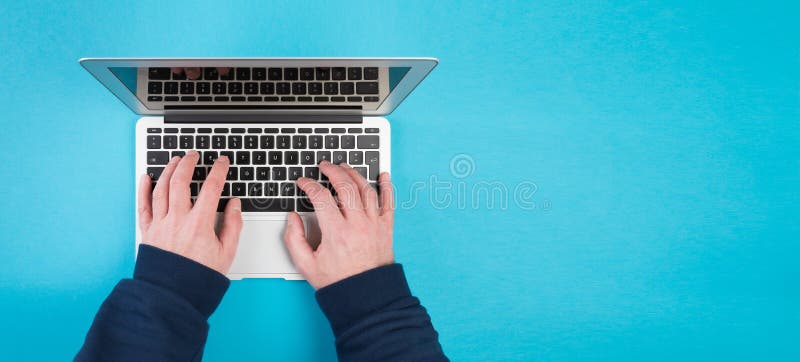 Above Shot of Person Using Laptop Computer on Blue Desk Stock Image ...