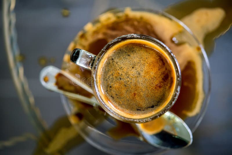 Coffee Cup with Spilled Coffee on Table Stock Photo - Image of coffee ...