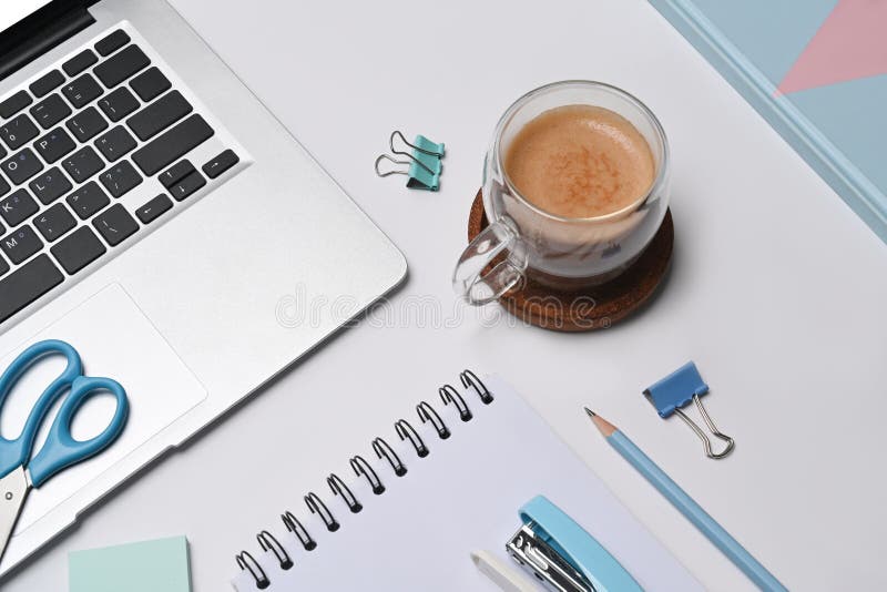 Cup of Coffee, Laptop Computer and Notepad on White Table. Stock Image ...