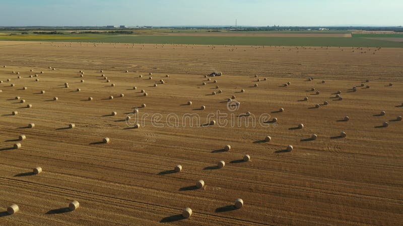 Aerial View of Tractor Tow Trailed Bale Machine To Collect Straw from ...