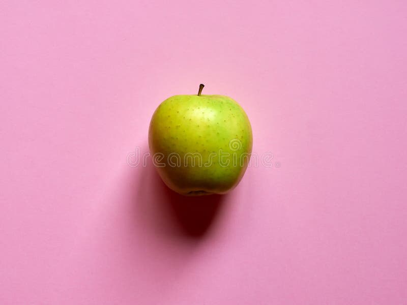 Above View of a Green Apple Isolated in a Pastel Pink Background Stock ...