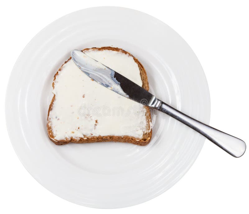 Above View of Knife on Bread with Spread on Plate Stock Image - Image ...