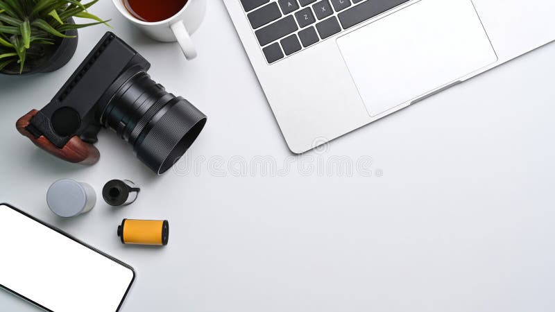 Laptop Computer, Coffee Cup and Camera Accessories on Photographer ...