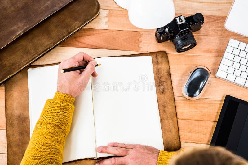 Above View of Man Writing on Notebook Stock Image - Image of desk ...
