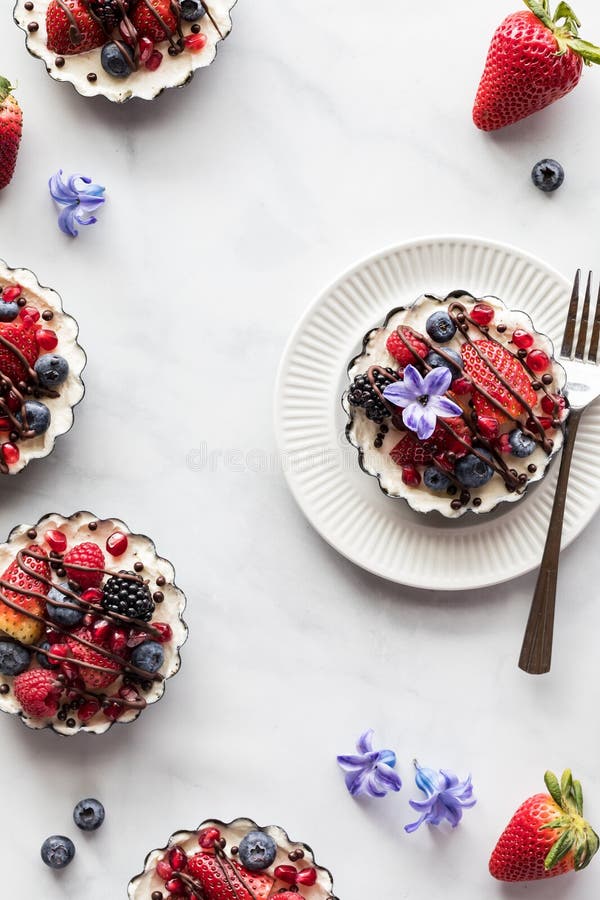 Above View of Mixed Berry Cheesecake Tarts with Copy Space in the ...