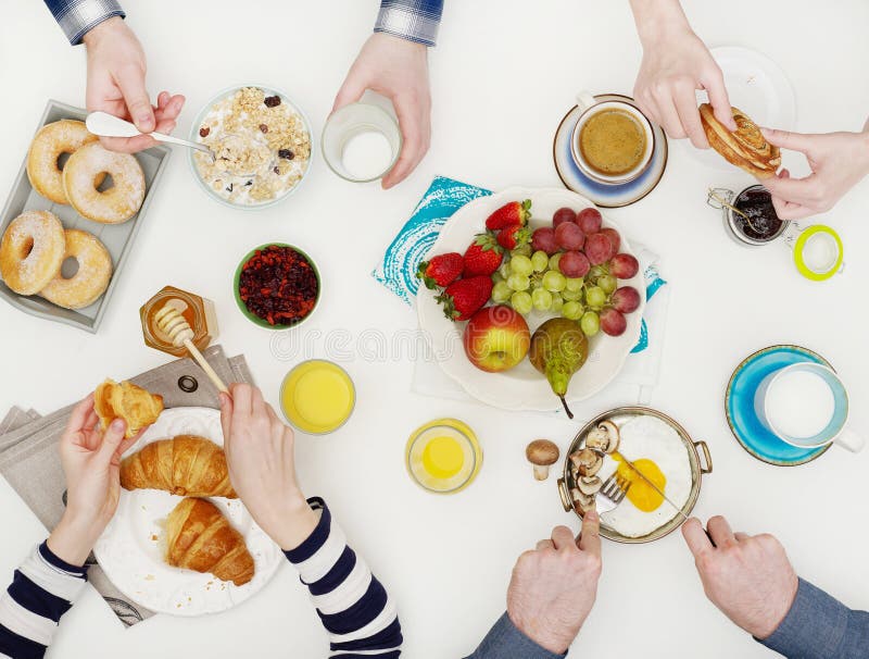 Friends eating breakfast stock photo. Image of drink - 324503144