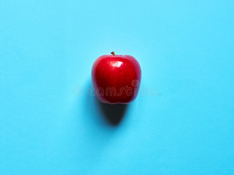 Above View of a Red Apple in a Blue Background Stock Image - Image of ...