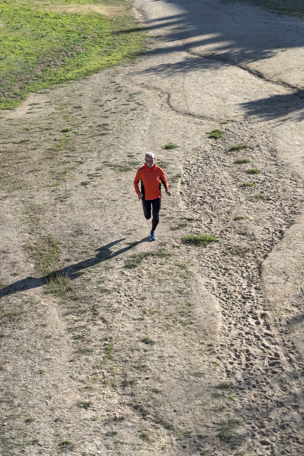 Above View of Senior Man Jogging through Park Stock Photo - Image of ...