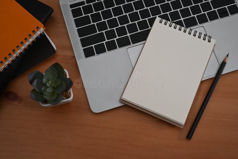 Simple Workplace with Laptop Computer, Notepad, Coffee Cup and ...