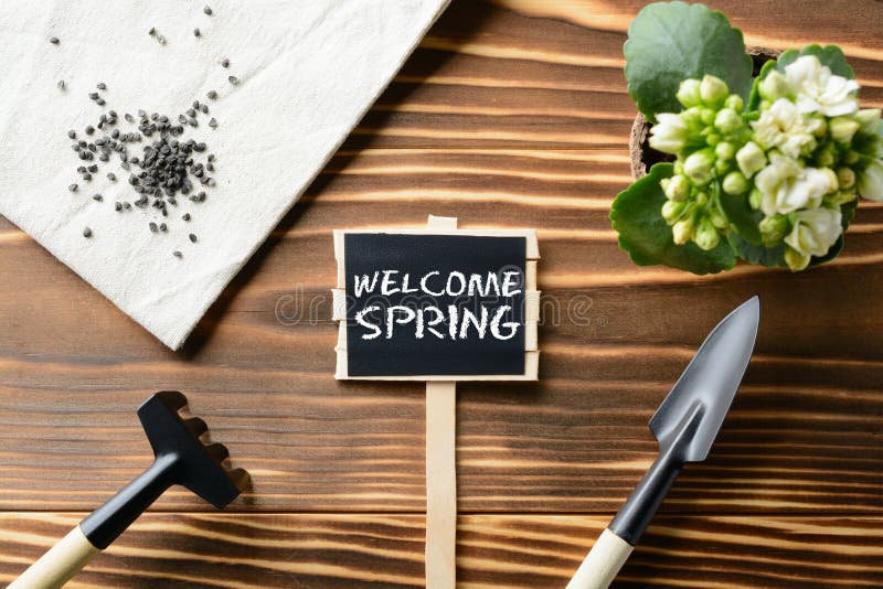 Welcome Spring Sign with Tools on Table Stock Photo - Image of season ...