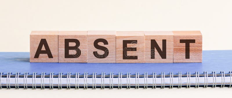 ABSENT - a Word Made of Wooden Blocks with Black Letters, a Row of ...
