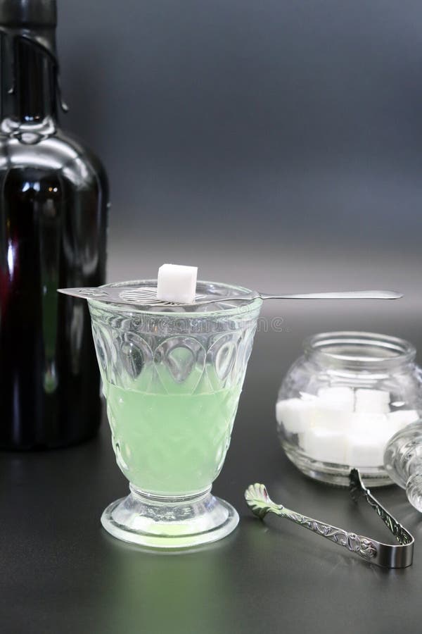 Absinthe in an Old Scratched Glass Stock Image - Image of drunk, green ...