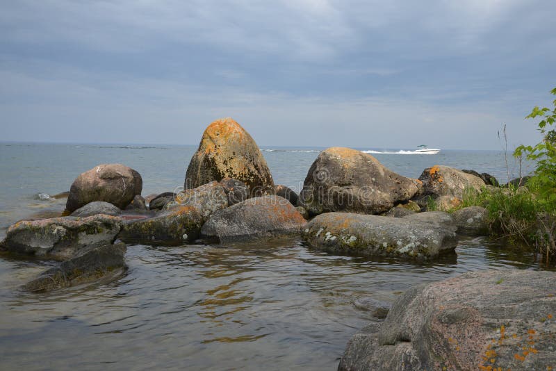 The Shore of the Lake. the Texture of the Stone is Overgrown with Moss ...