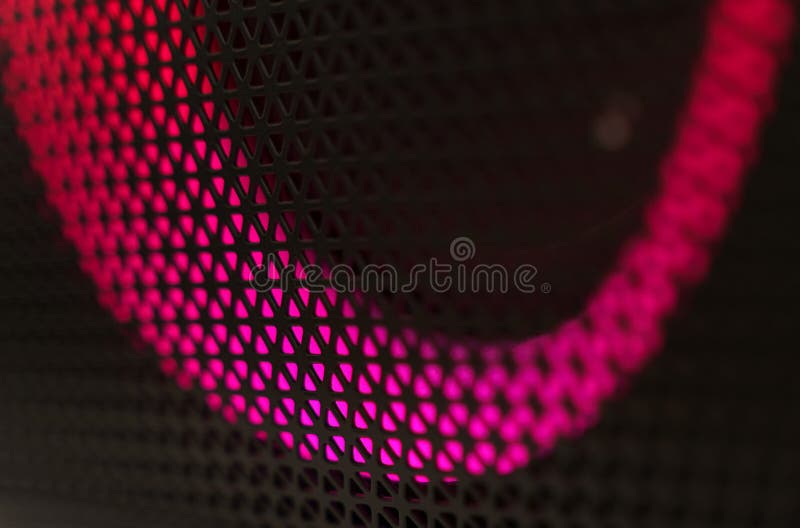Abstract Background of a Black Patterned Lattice Behind Which Glow Red ...