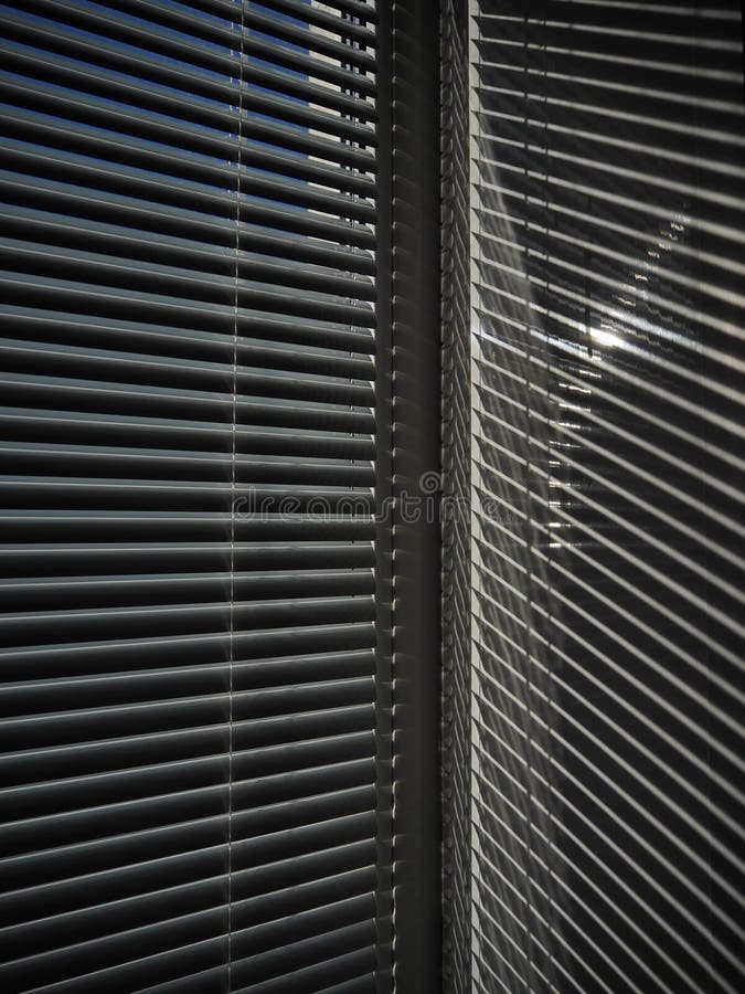 Blinds on the Window and a Pattern of Shadow and Light on the Wall ...