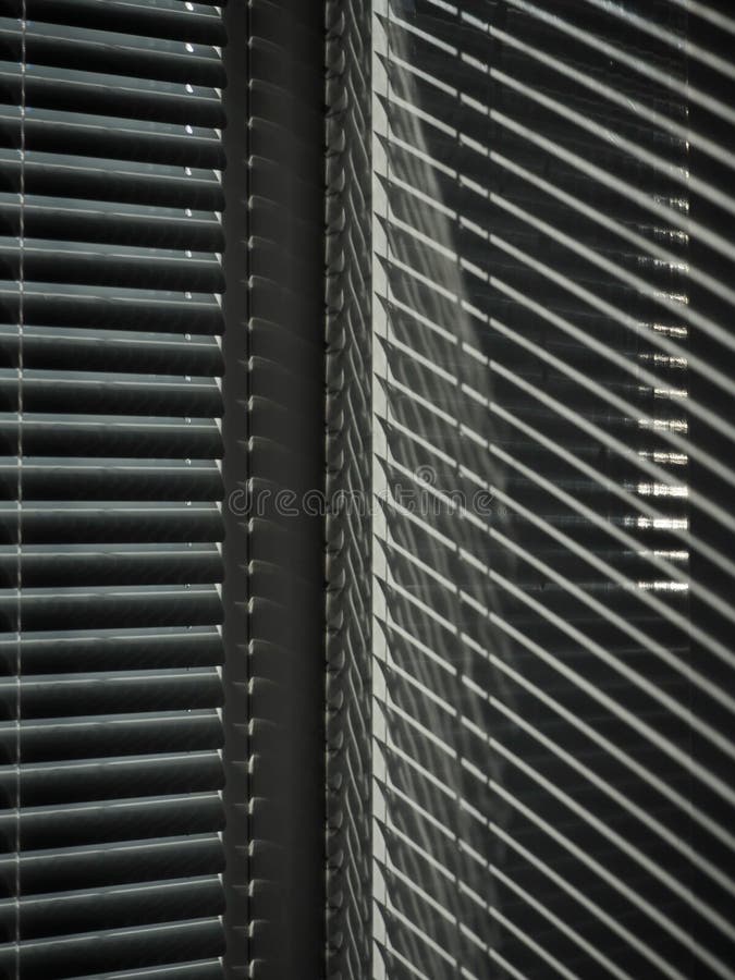 Blinds on the Window and a Pattern of Shadow and Light on the Wall ...