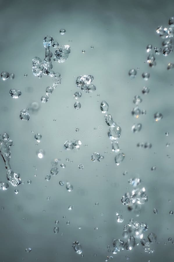 Abstract Background, Drops of Water Splash in the Air on a Light ...