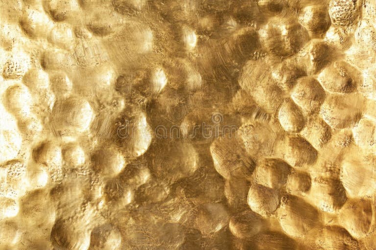 Abstract Background of Golden Hammered Brass Surface. Metallic Texture ...