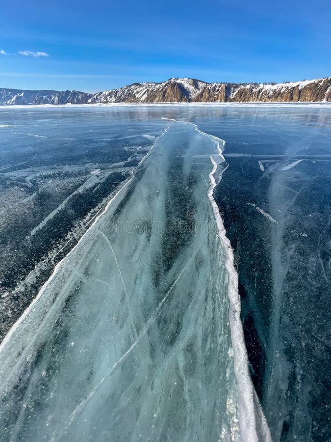 The Natural Texture of Winter Ice with White Bubbles and Cracks on a ...