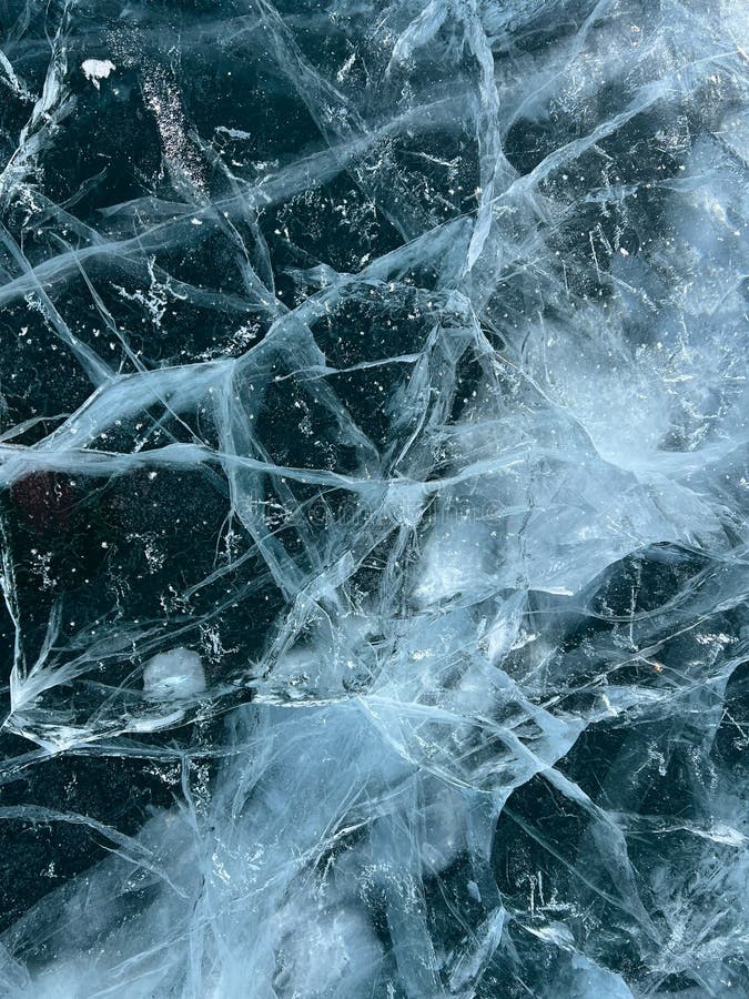 The Natural Texture of Winter Ice with White Bubbles and Cracks on a ...