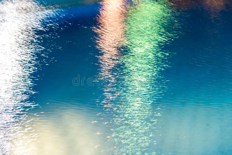 Abstract Background, Texture of Blue Water with Multicolored Highlights ...