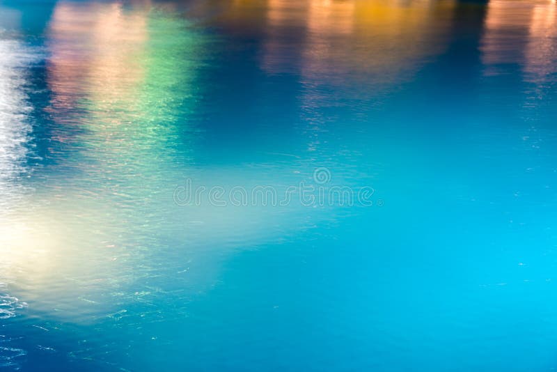 Abstract Background, Texture of Blue Water with Multicolored Highlights ...