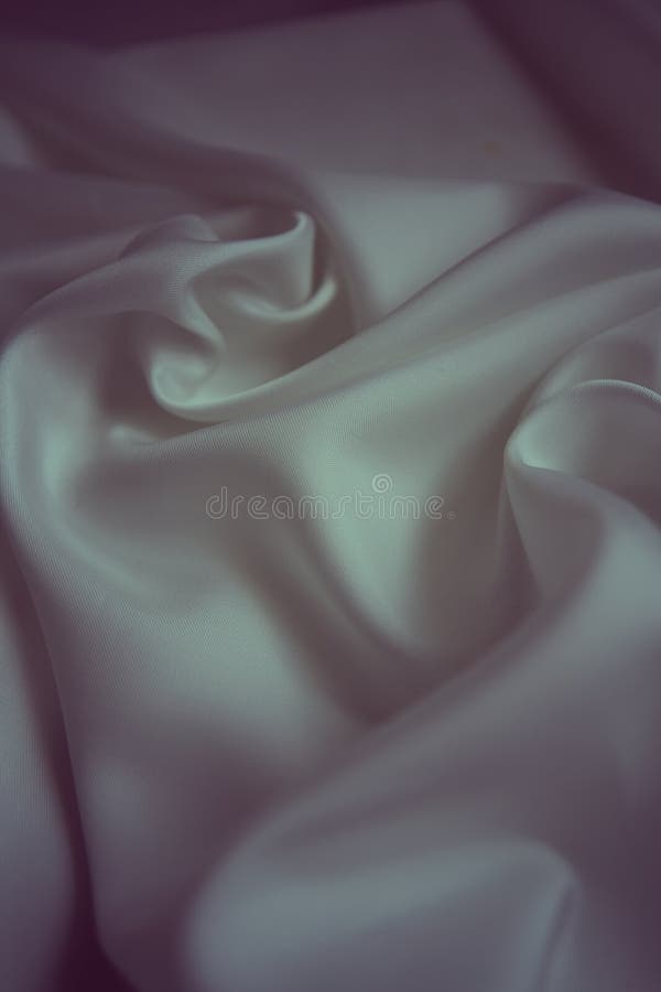 Silk Satin Fabrics in Various Shades of Grey Gracefully Flow and Curl ...