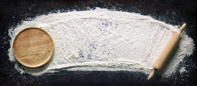 Abstract Baking Background with the Rolling Pin and Flour on Dark Table ...