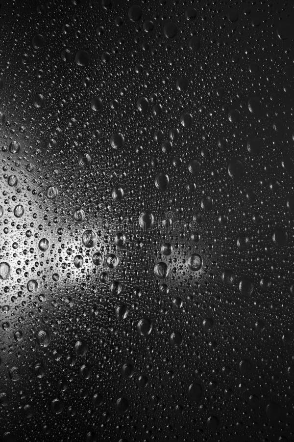 Abstract Black Background with Lights Reflected in Surface Splashed ...