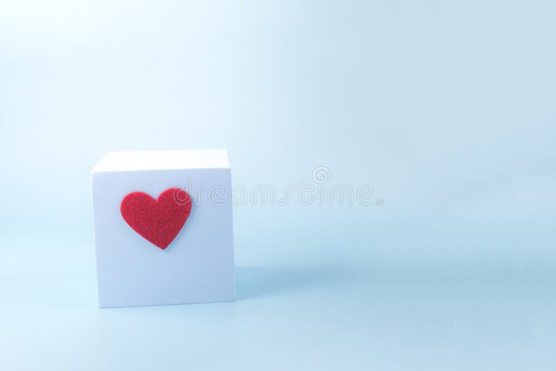 Abstract Blue Cube with a Bright Heart on a Blue Copy Space Background ...