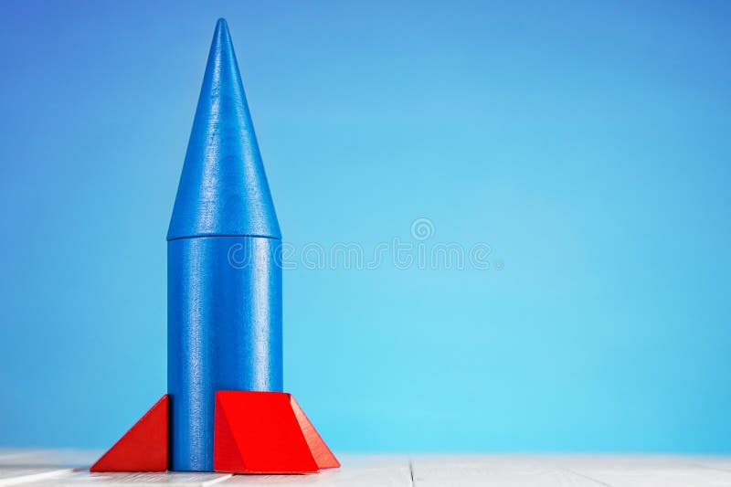 Abstract Blue Rocket from Wooden Blocks with Copy Space. Stock Photo ...