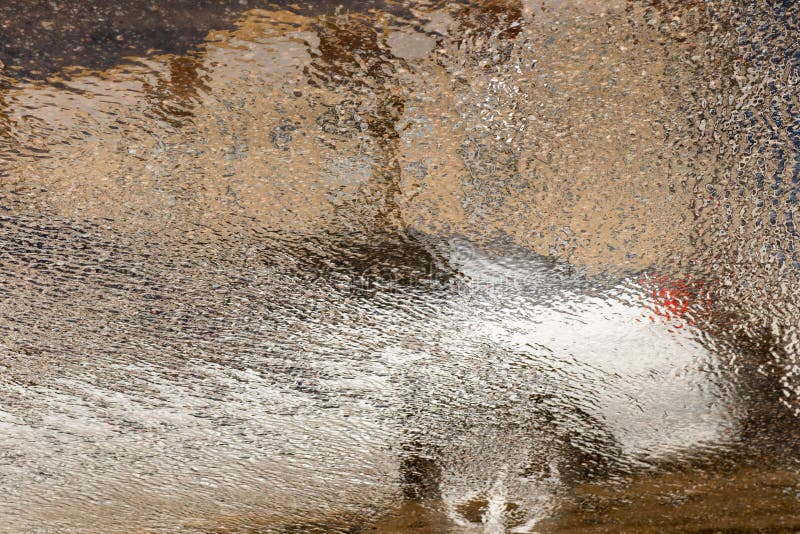 Abstract Blurred Car Reflection in a Puddle Stock Photo - Image of ...