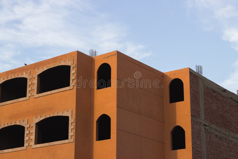 Abstract Building Made of Orange Stone Under Construction, Egypt Stock ...