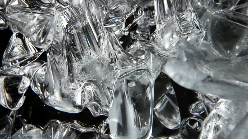 Abstract Close-up of Shattered Ice Fragments Against a Dark Background ...