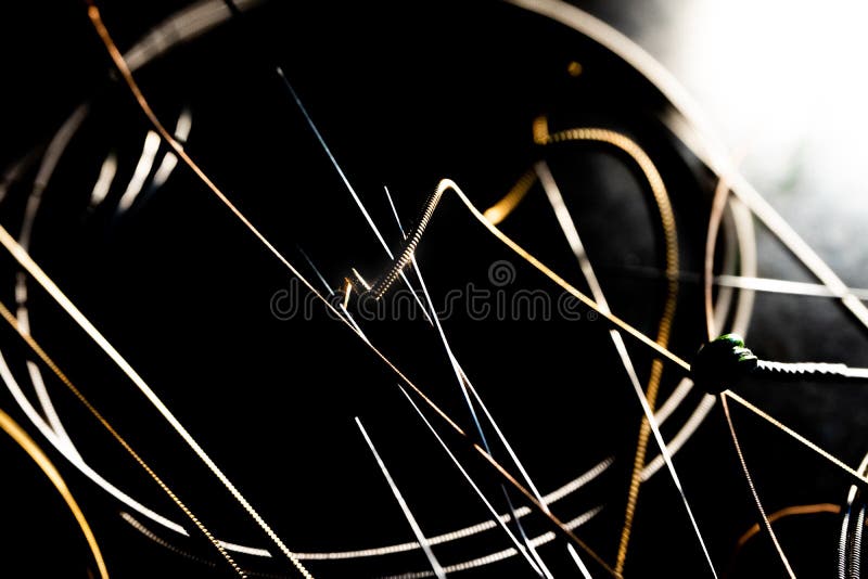 Abstract Closeup of End on Used Bronze Acoustic Guitar String in Front ...