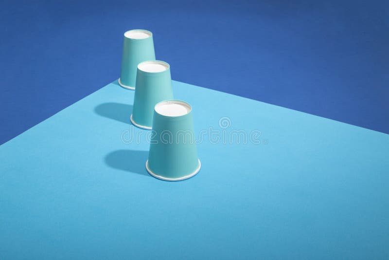 Abstract Composition with Eco Disposable Paper Cups on Blue Background ...